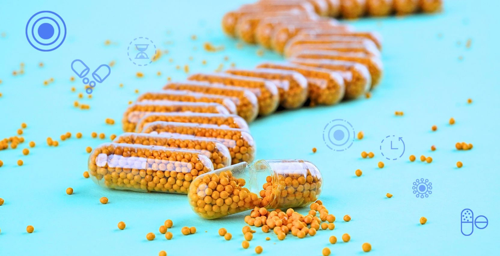 Multiple transparent capsules filled with orange encapsulated pellets ...